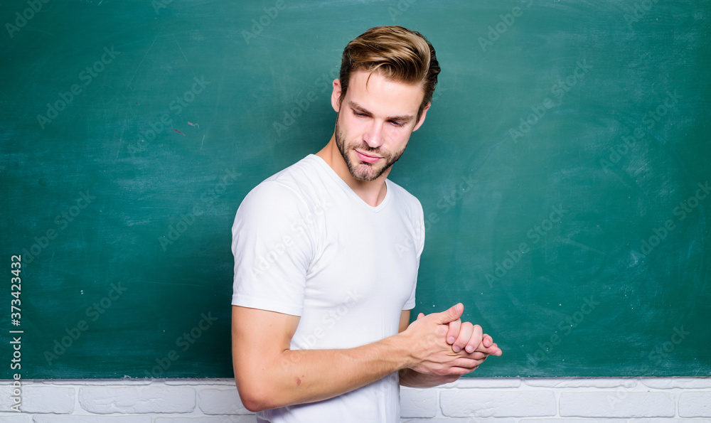 Man teacher in front of chalkboard. Teaching could be more fun ...
