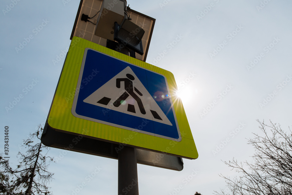 The pedestrian crossing sign powered by solar panels installed above ...