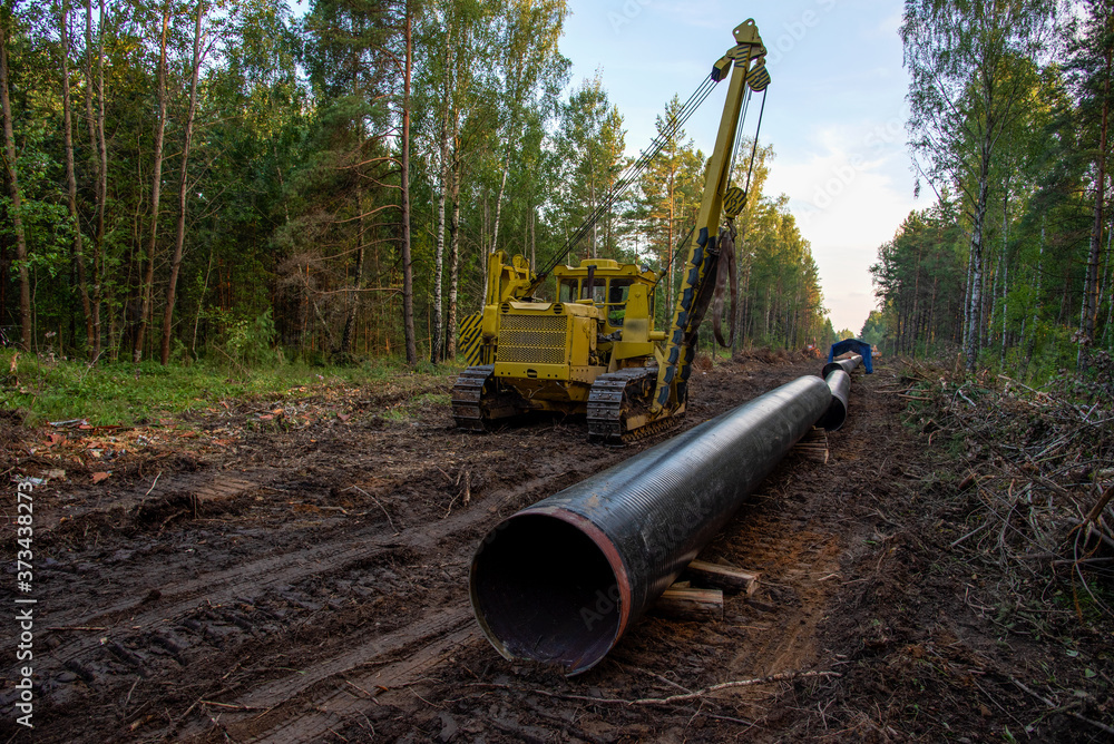 Pipelayer with side boom Installation of gas and crude oil pipes in ...
