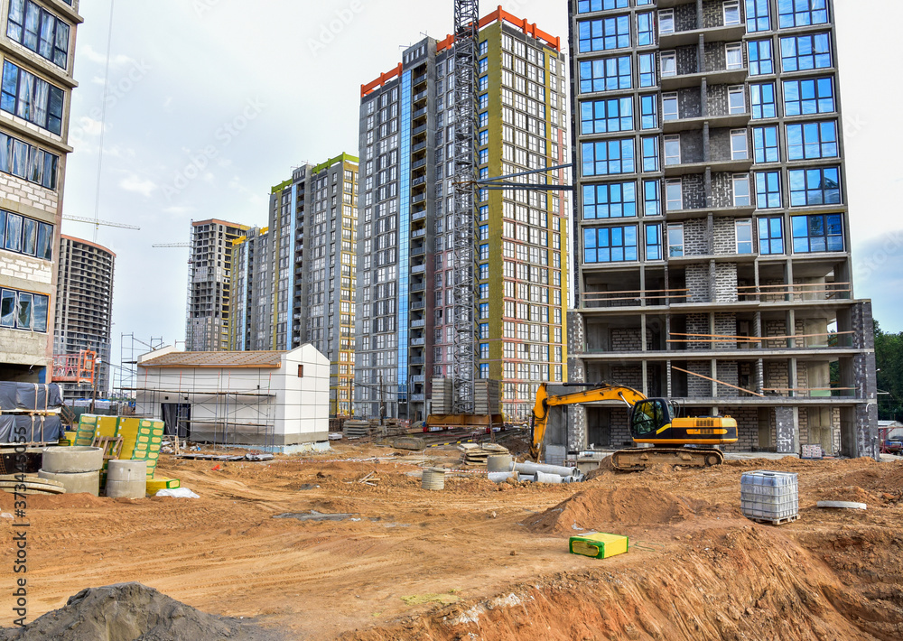 Excavator working at largest construction site. Backhoe on earthworks ...