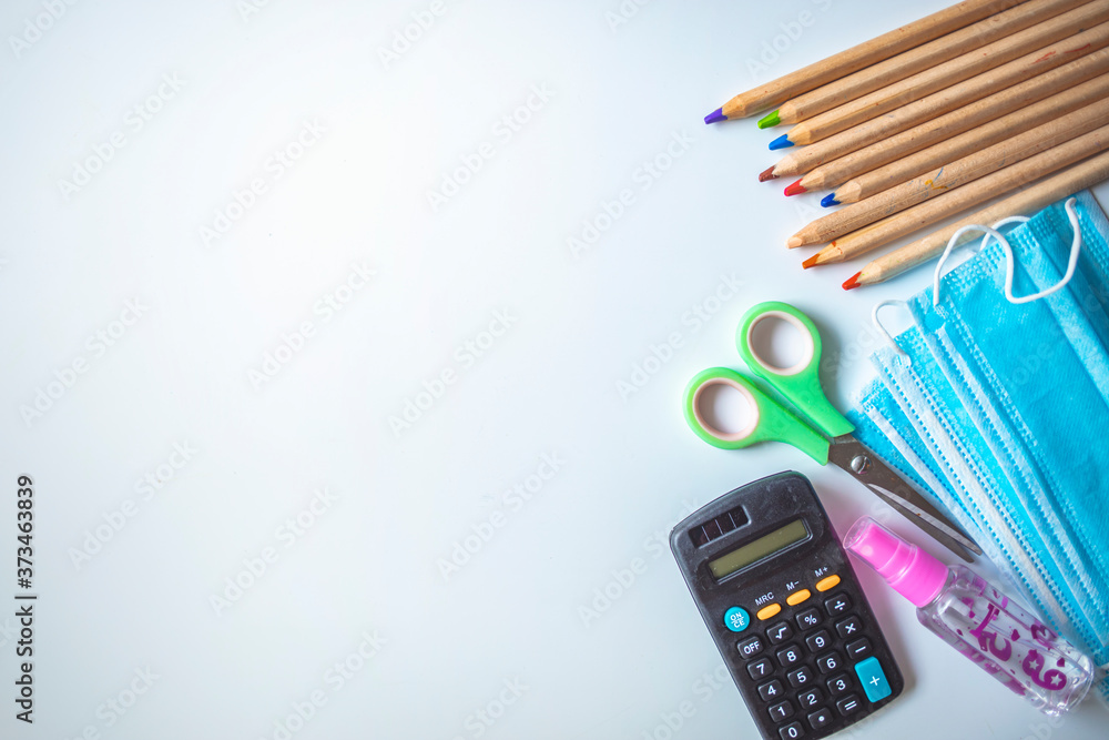Backpack of school child with face mask and sanitizer. Student safety ...