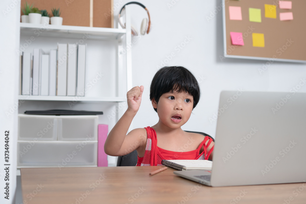 Happy Asian girl student online learning class from a computer with a ...