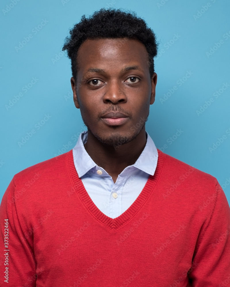 Portrait of real black african man with no expression for ID or ...