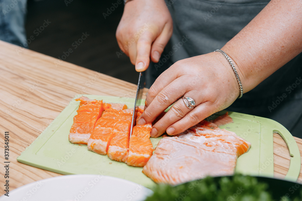 Cooking red fish in a cooking mater class. The butchering of the fish ...