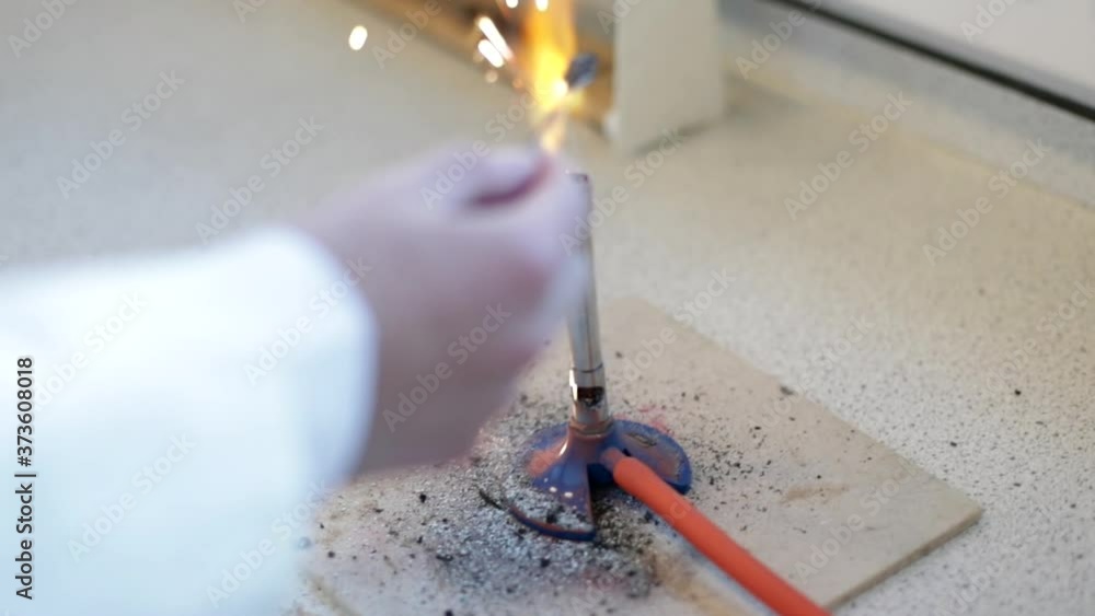 Sparks fly from chemical reaction using bunsen burner (slow motion ...