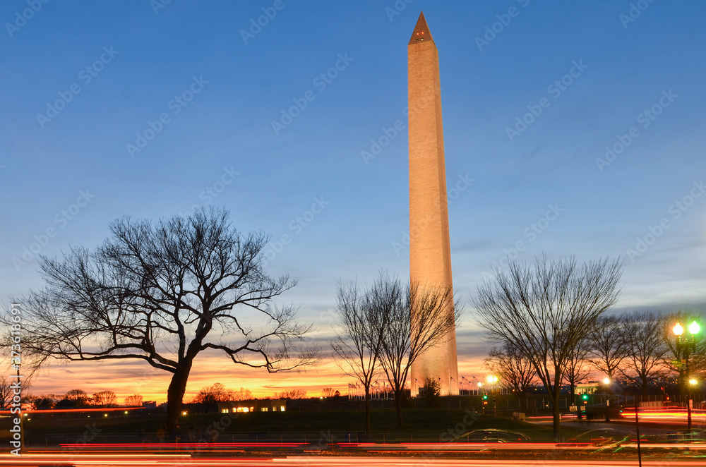 Washington Monument at night with street lights and car headlamp trails ...