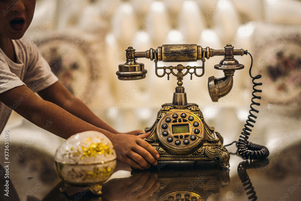 Boy play with Antique Vintage rotary old hang up telephone beautifully ...