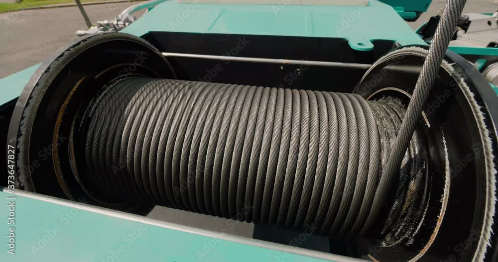 Drum hoist winch. Close-up of mobile crane electric drum winch. Hoist ...