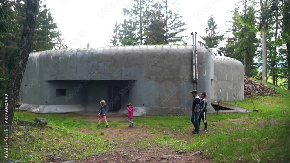 Zoom FHD shot of a family with two little daughters visiting an old ...
