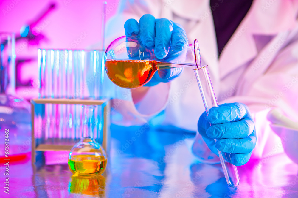 Experiment with mixing chemical liquids. Laboratory analysis of raw ...