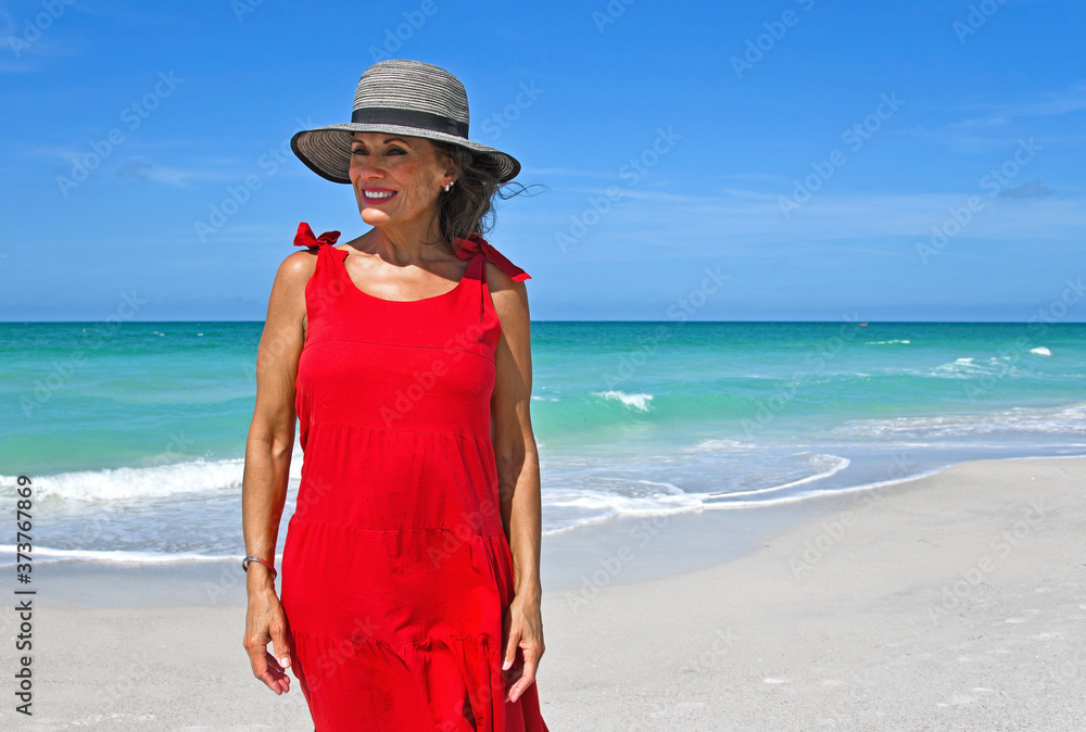 Beatiful Mature Woman in Red Dress Stock Photo | Adobe Stock