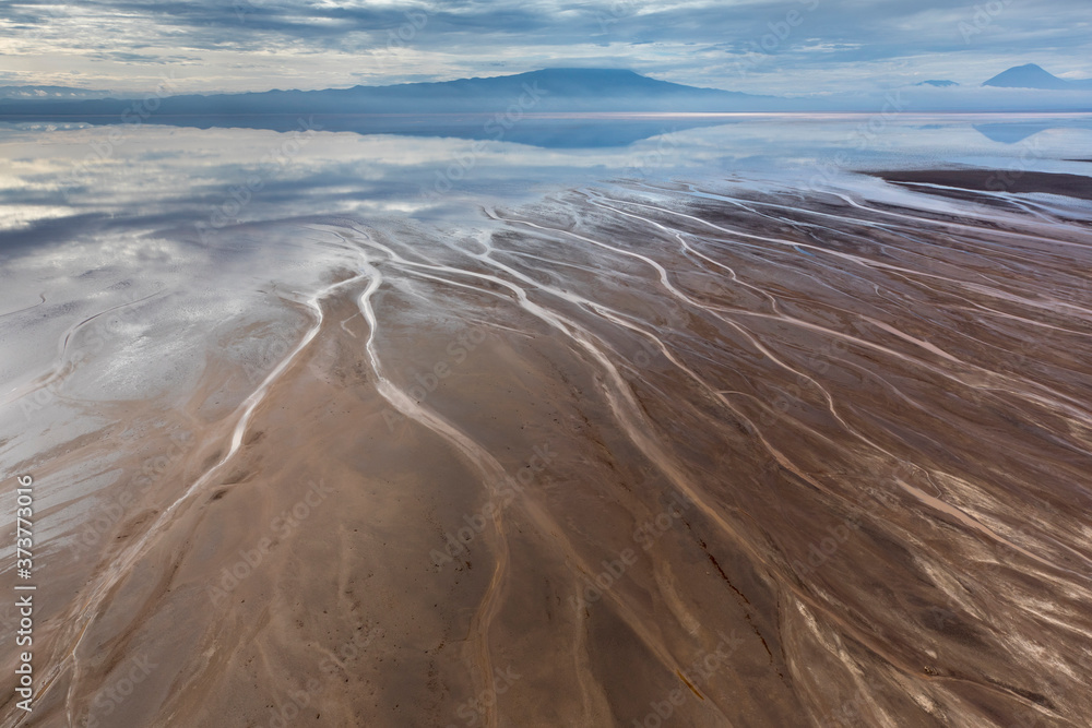 Africa, Tanzania, Aerial view of streams winding along shore of Lake ...