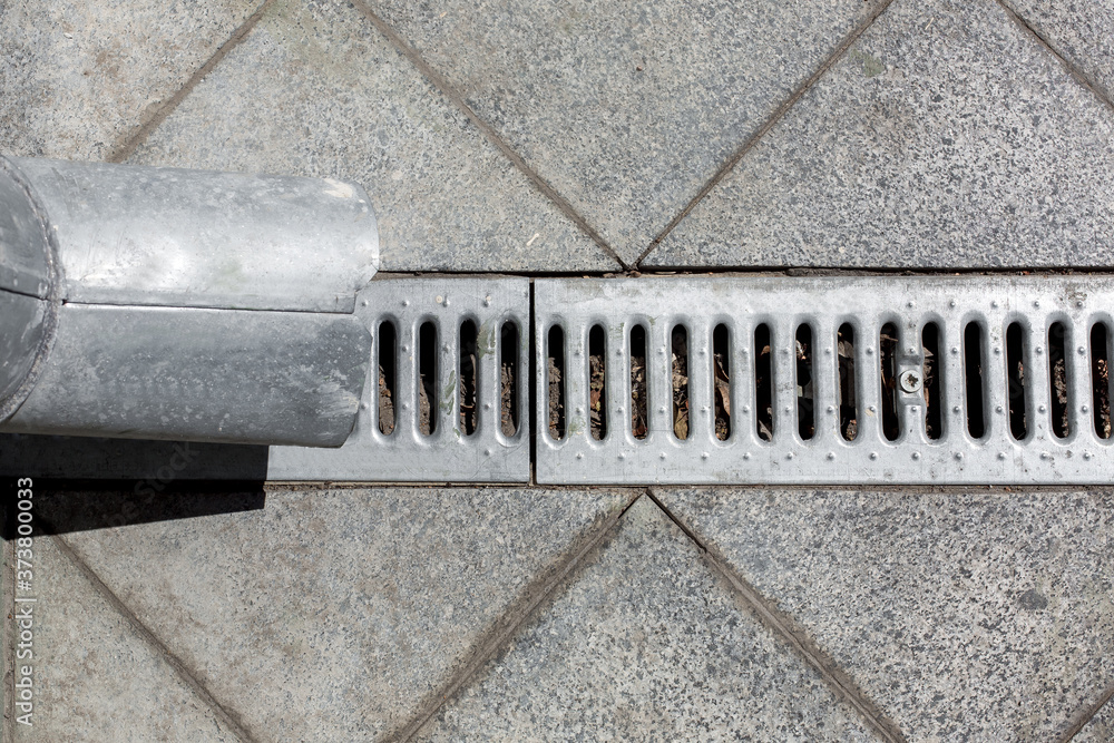 Foto de an engineering structure a drainpipe with a drainage grate for ...