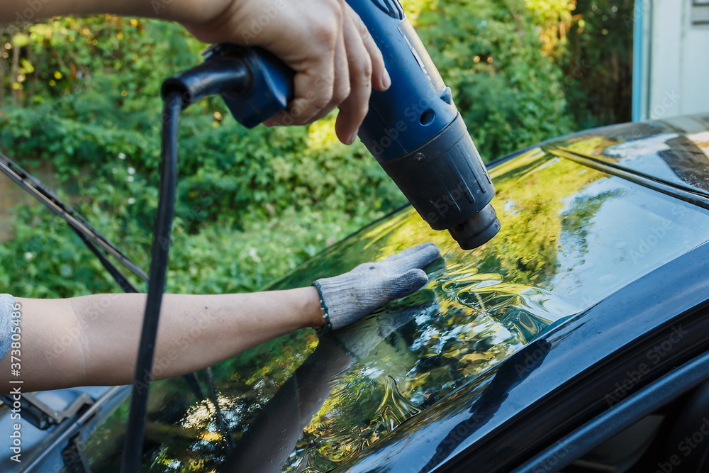 Car Films Installing windshield protection film blur.; Stock Photo ...