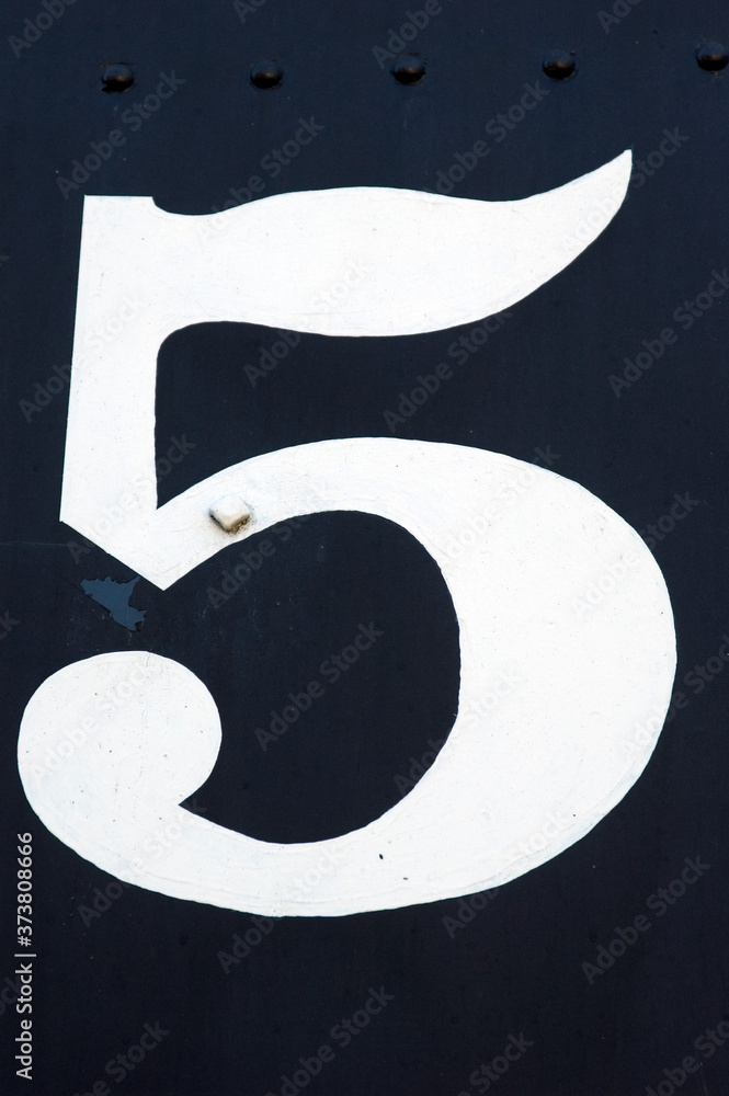 Old used faded worn torn and tattered photo of individual numbers 0 to ...