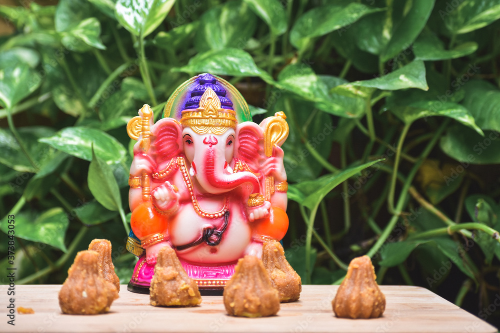 Close up of statue of lord Ganesha with modak during the Ganesh ...