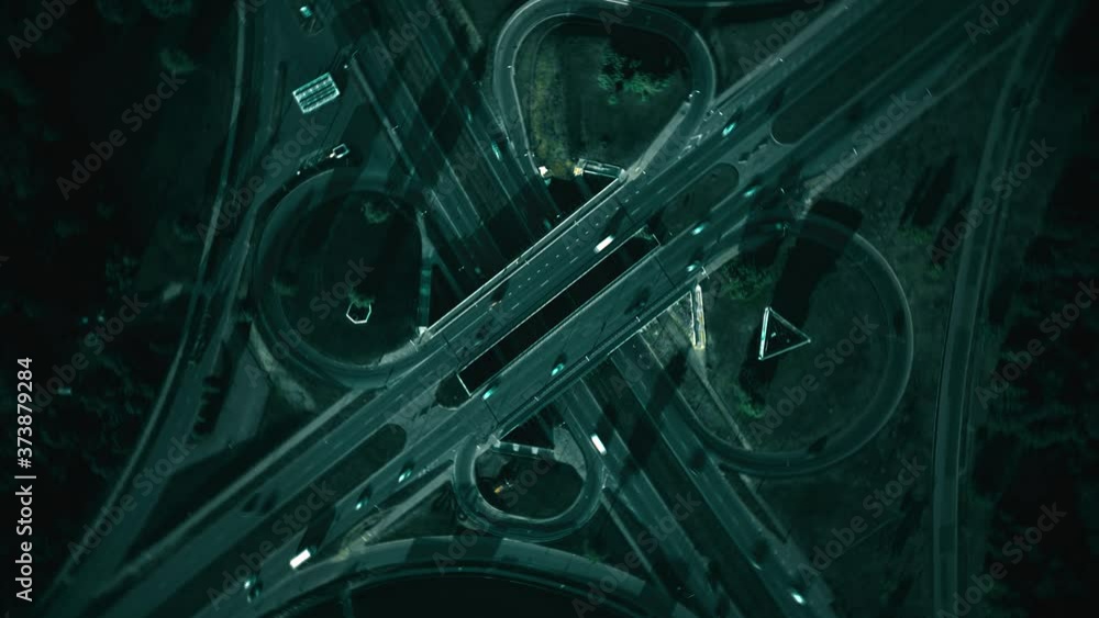 Dark night intersection, aerial spin hyperlapse. Traffic on highway ...