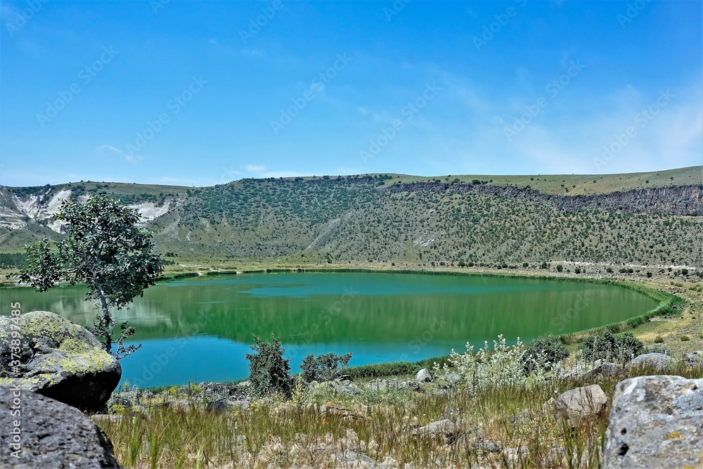 Lake Nar in the crater of an extinct volcano. A round reservoir of ...