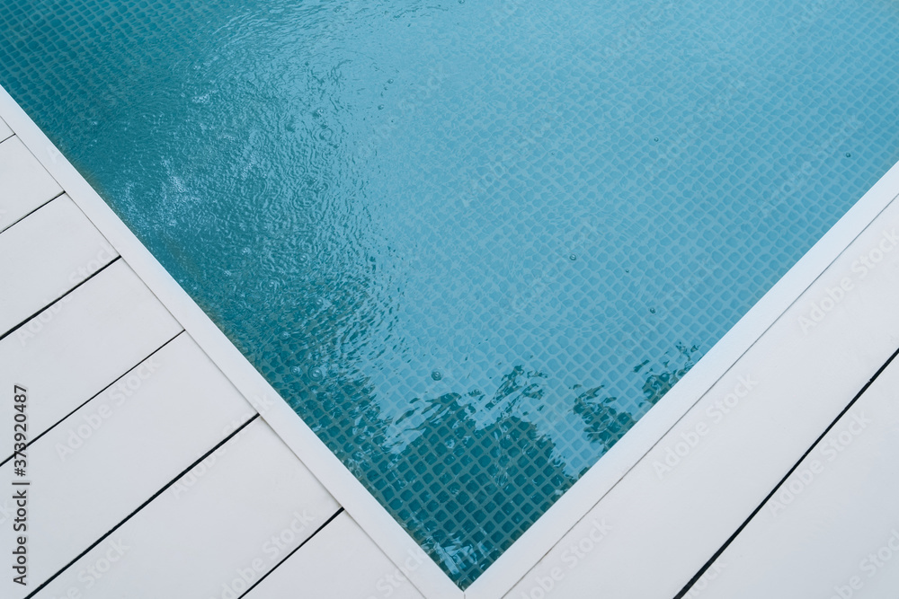 Part of swimming pool with blue water. Bright blue water in the pool ...