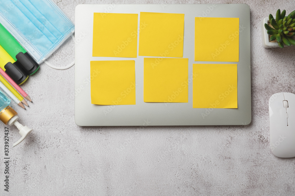 Yellow post note paper, memo paper on laptop computer. scheduled for ...