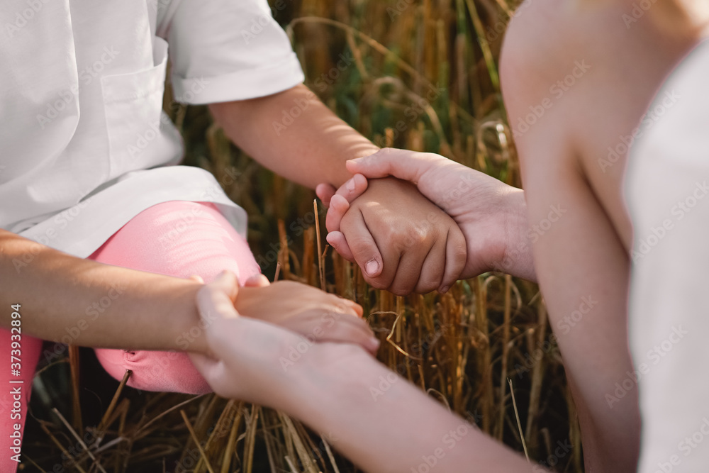 Girls praying and holding hands in a wheat field. Pray for God each ...