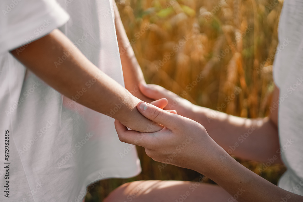 Girls praying and holding hands in a wheat field. Pray for God each ...