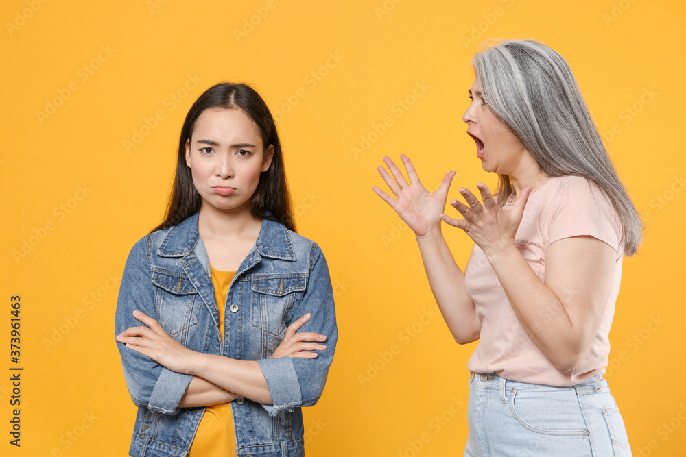 Angry offended family asian women girls gray-haired mother and daughter ...
