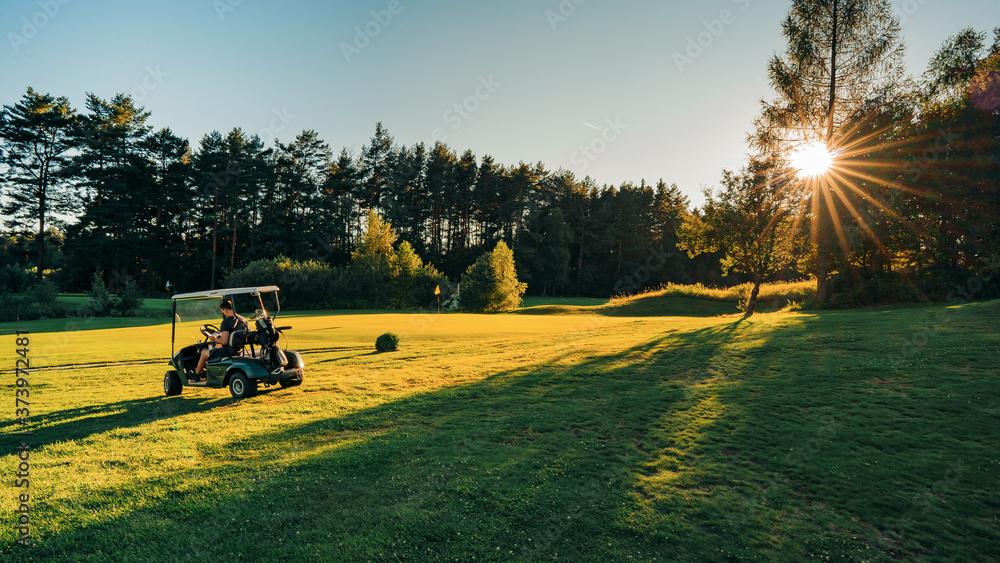 Golf cart or golf club cars in a beautiful golf course. Green golf and ...
