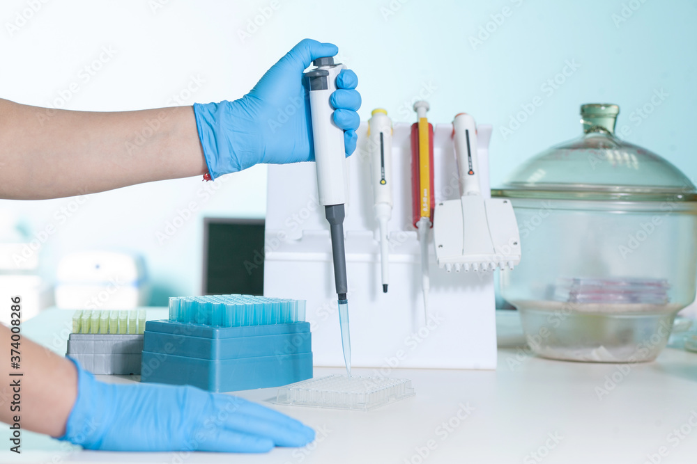 Hand in glove with automatic pipette for pcr analysis of nucleic acids ...