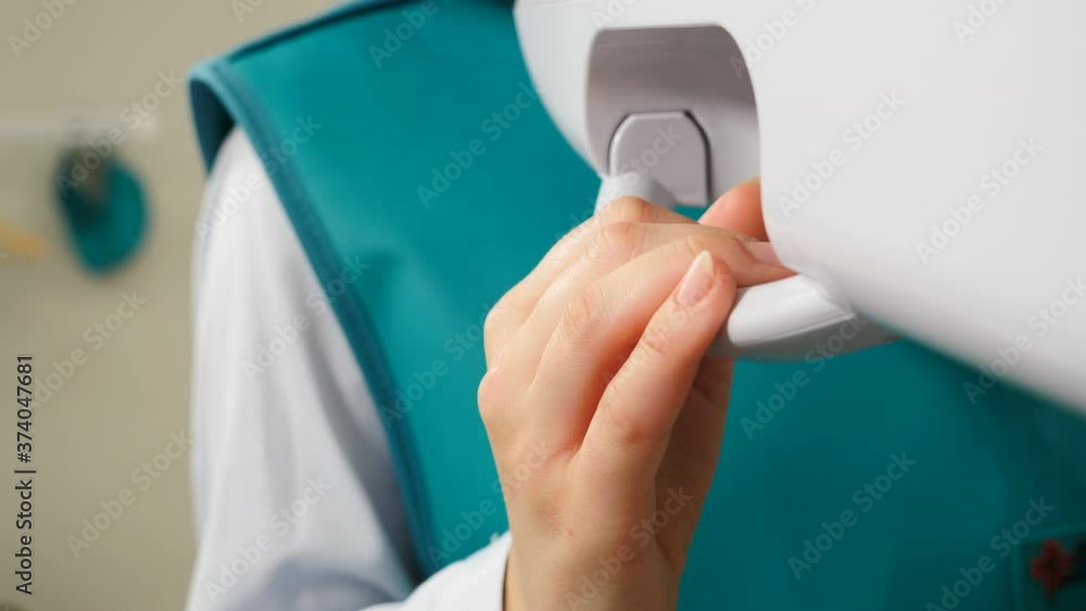 Dental Ct scanner in modern dental clinic. Close-up shot of female hand ...