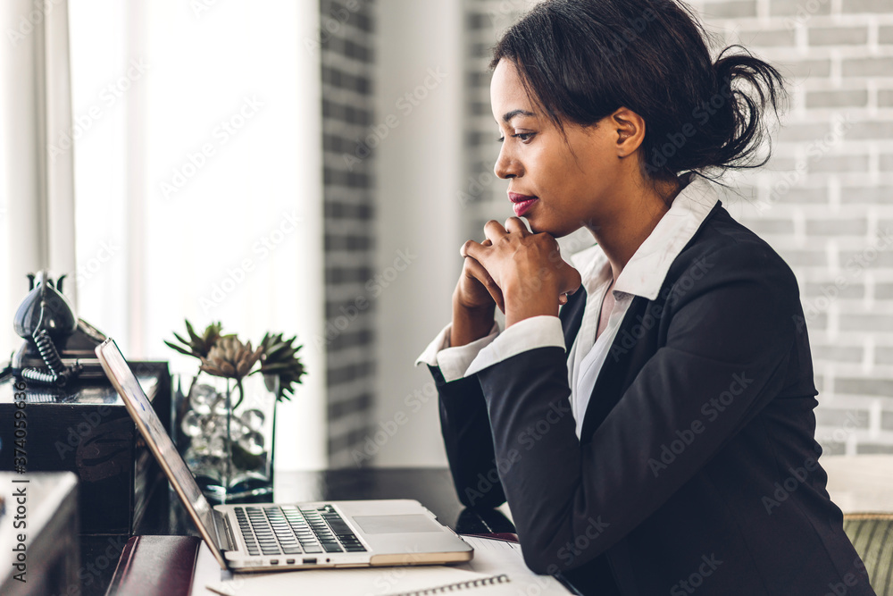 Portrait of smiling happy african american black woman relaxing using ...