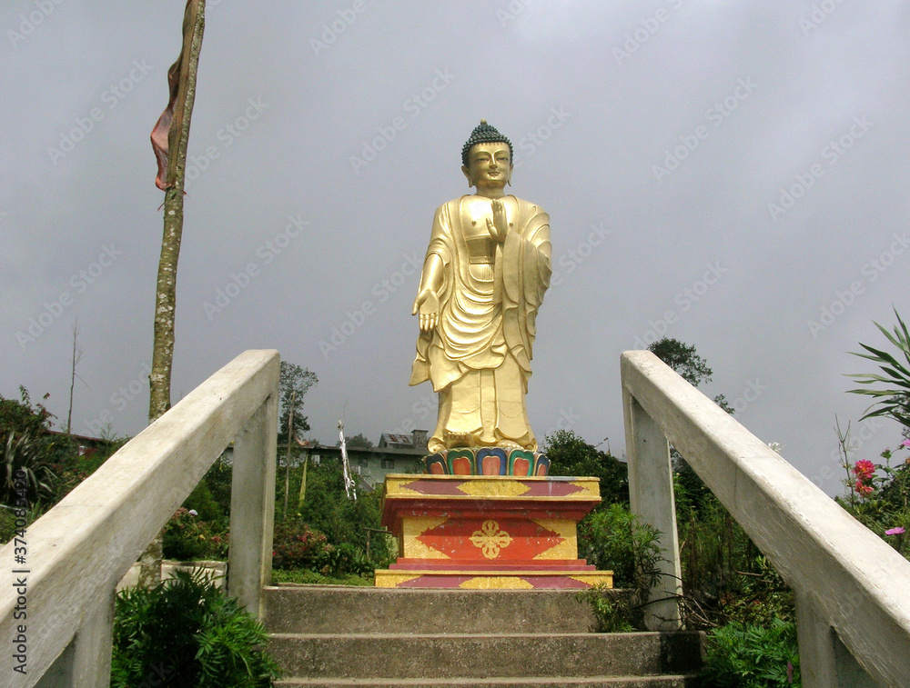 The statue of Lord Buddha shines bright at Gumba Dara in Kalimpong, India. This place famous for ...