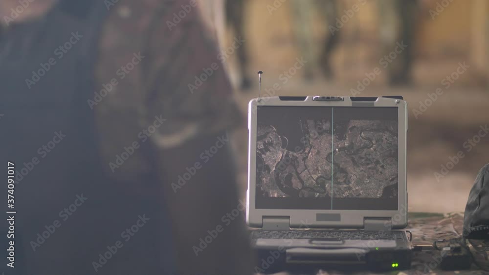 Video „Focus on display of army grade laptop with satellite map of area ...