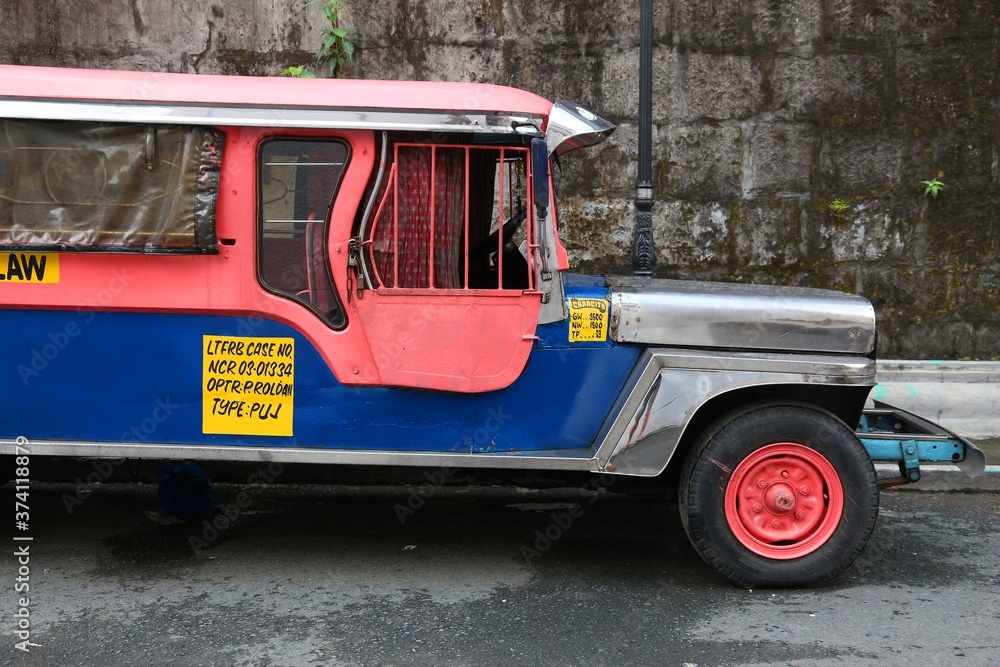 MANILA, PHILIPPINES - NOVEMBER 24, 2017: Jeepney public transportation ...