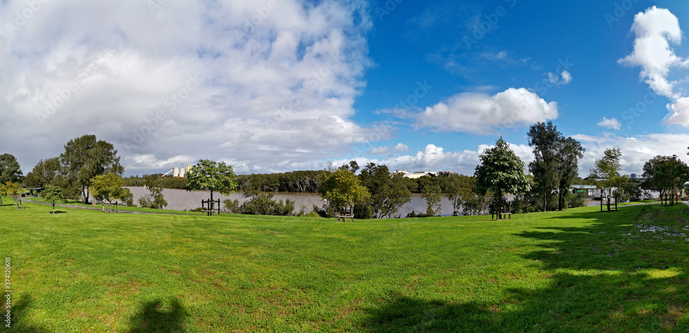 Beautiful panoramic view of a park with green grass, tall trees ...