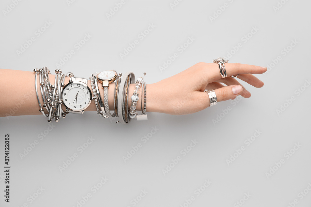 Female hand with stylish wrist watches on white background Stock Photo ...