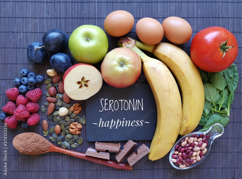 Serotonin-boosting foods. Assortment of food for good mood, happiness ...