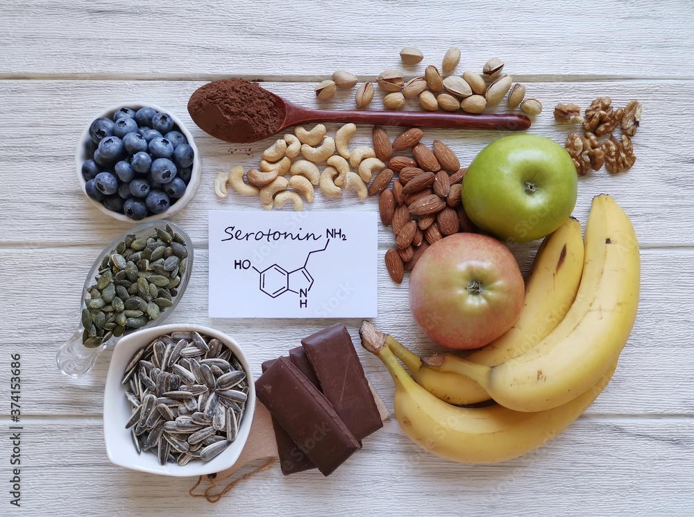 Serotonin-boosting foods. Assortment of food for good mood and ...
