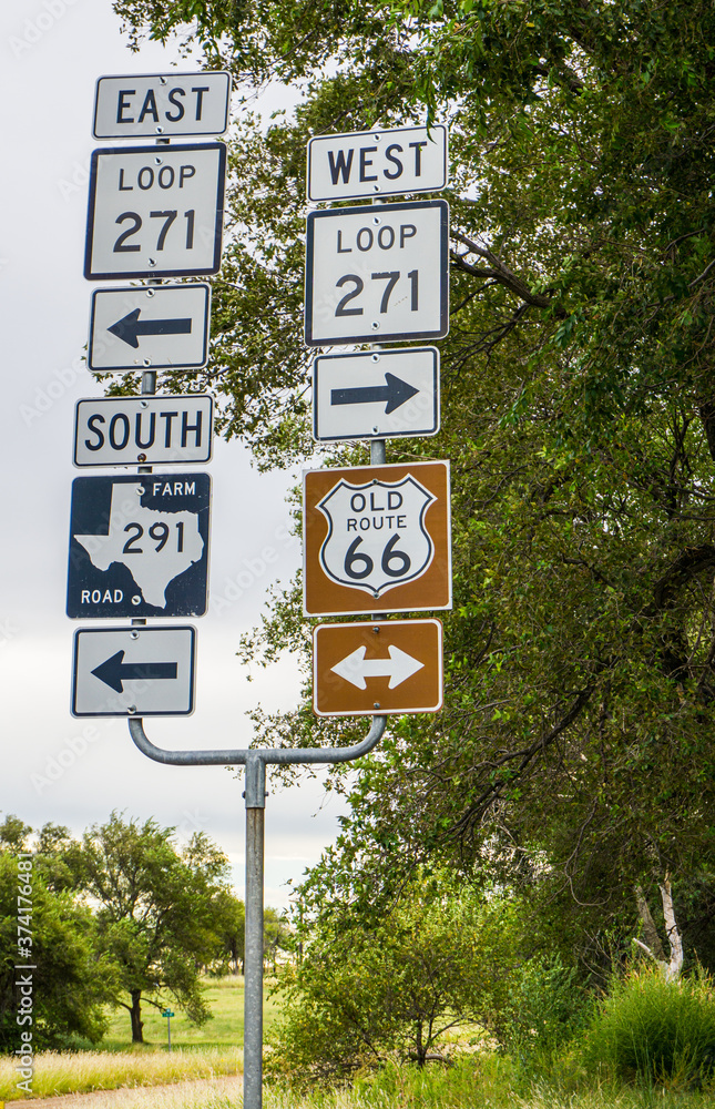 Multi directional roadsign, Texas showing directions east and west and ...