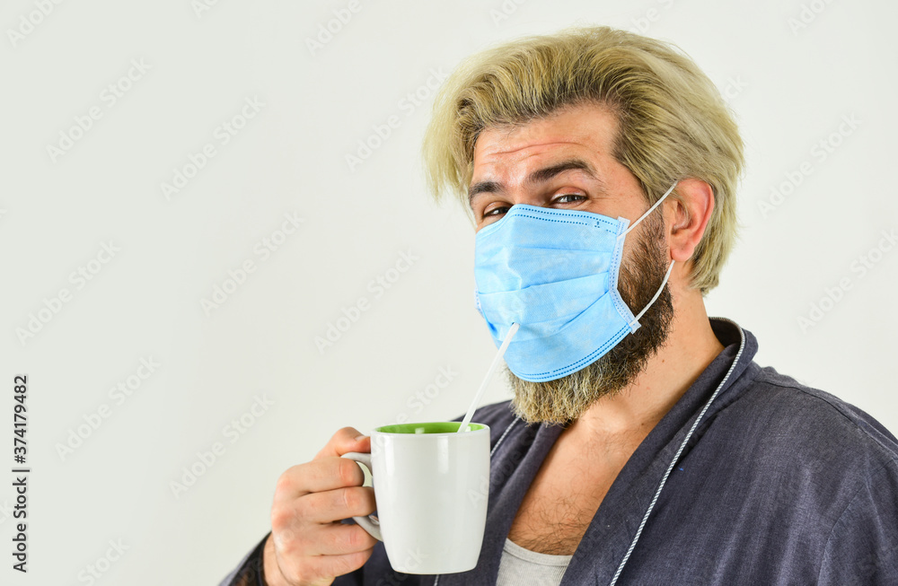 Guy in mask drink tea coffee using straw. Serious about hygiene. Cover ...