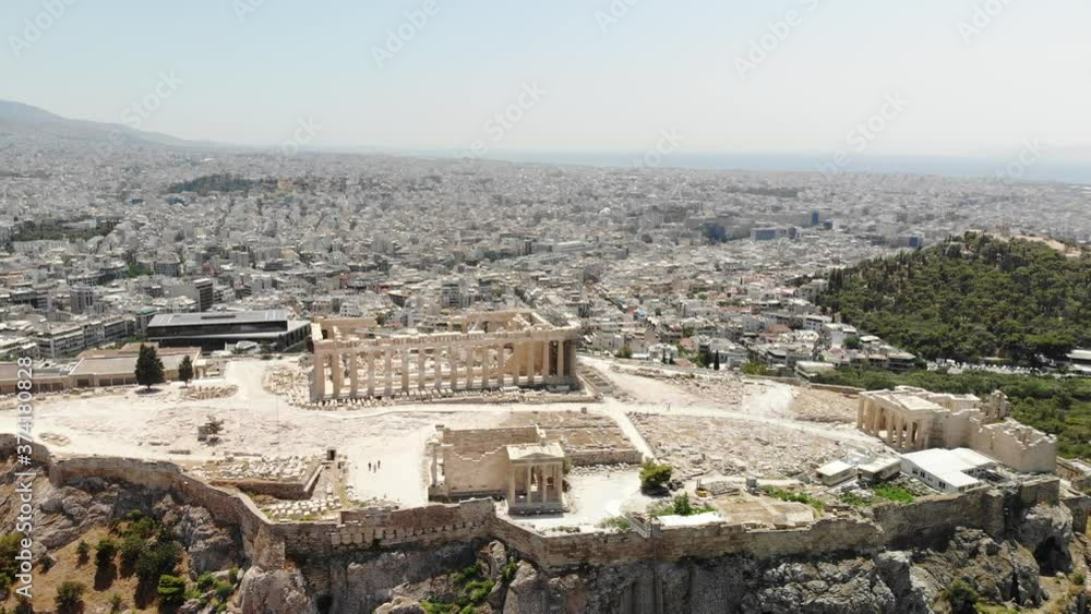 Rotating aerial shot of the Acropolis of Athens during summer period ...