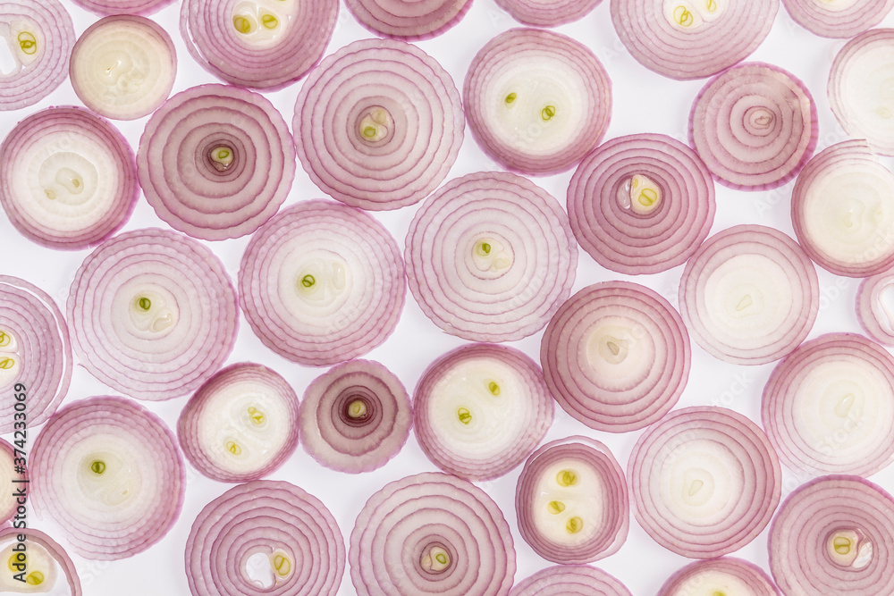 Onions background. Sliced onion cuts. Backlit photography. Light passes ...
