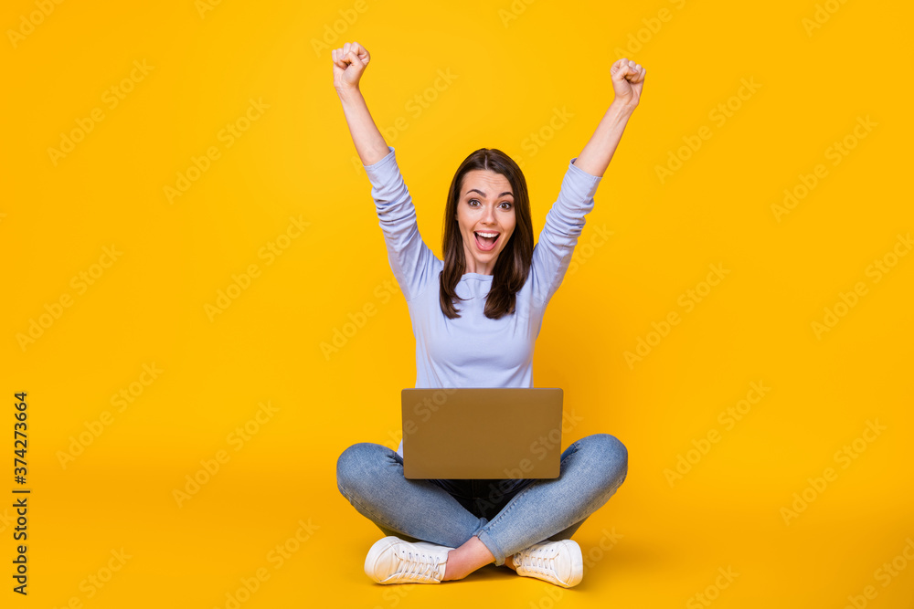 Full length photo of crazy ecstatic girl sit floor legs crossed work ...