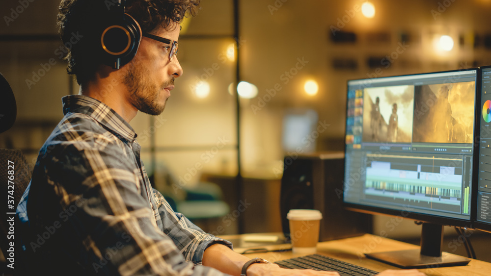 Evening in Creative Office: Professional Videographer / Audio Engineer ...