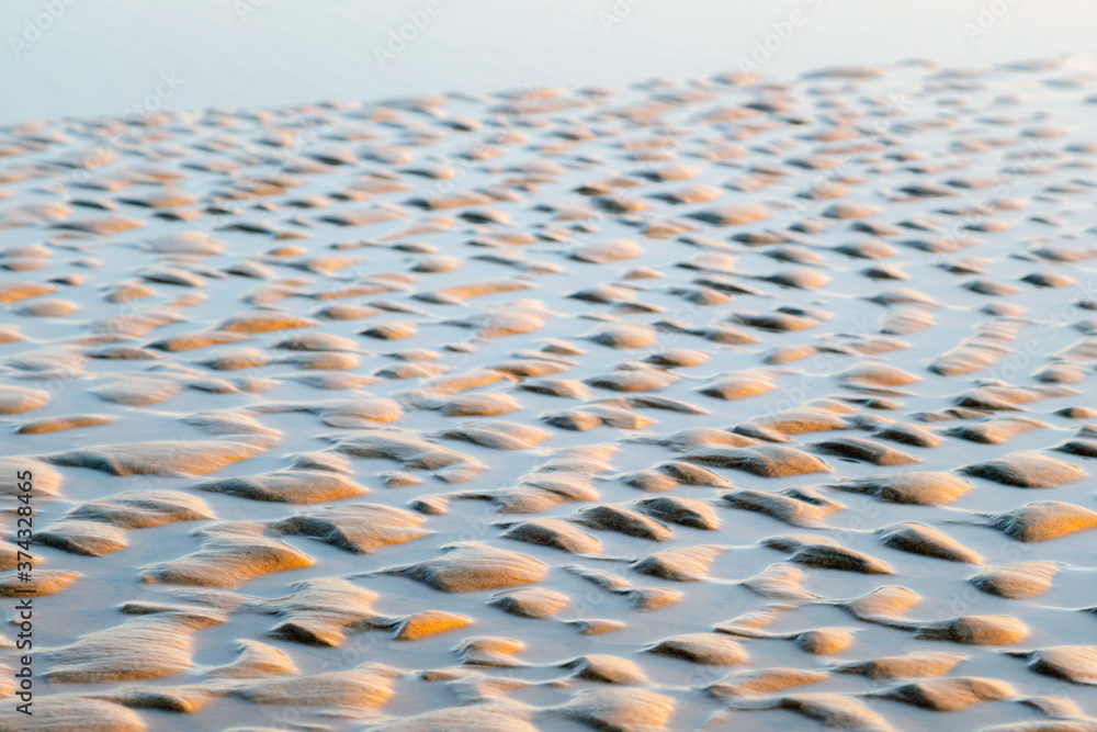Abstract view of natural sand dune formation at the beach. Curly sand ...