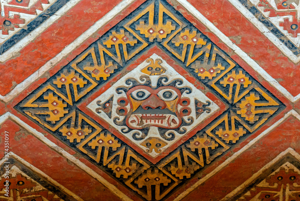 Bas relief of the Moche God Ai Apaec inside a tomb of the Huaca de la ...