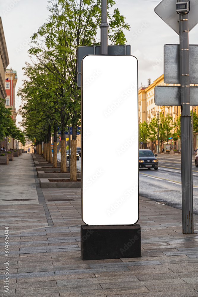 Billboard with white space for layouts and posters among street in the ...