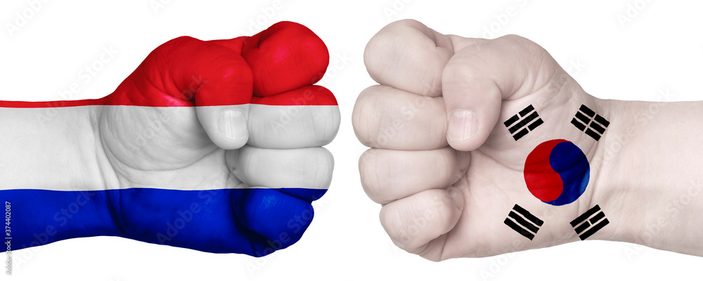 Two hands are clenched into fists and are located opposite each other ...