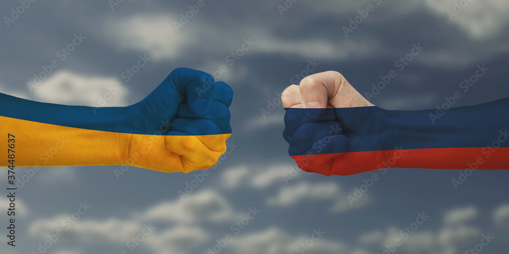 The concept of the struggle of peoples. Two hands are clenched into ...