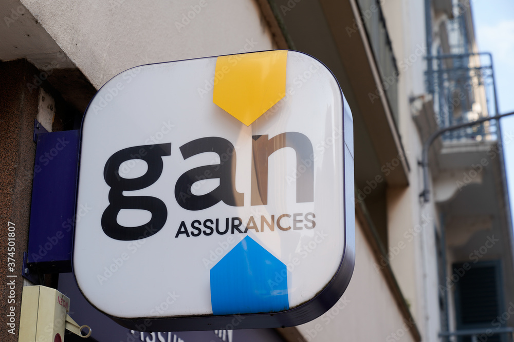 Gan text and sign logo front of insurance wall store office building ...